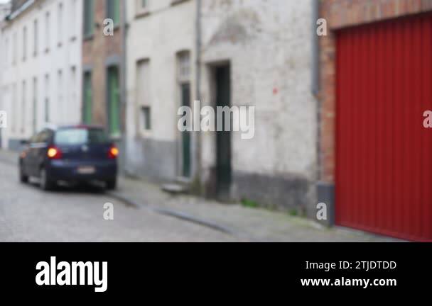 Out of focus background plate of cobblestone street in Europe with ...