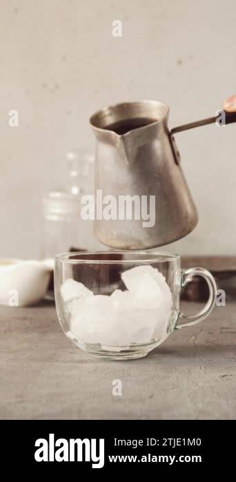 Cold Brew coffee making process. Hand pouring coffee and milk into a ...