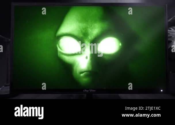 An Alien Grey face emerges from hypnotic television white noise static ...