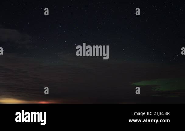 Aurora Borealis Northern Lights appearing on the night sky filled with ...