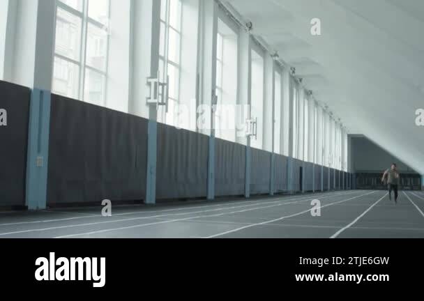 Professional male athlete with prosthetic leg running fast towards the ...