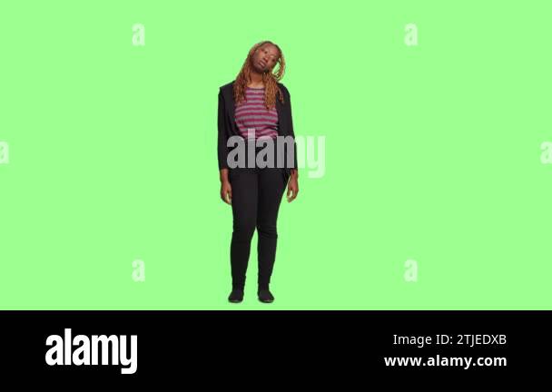 African american woman standing with full body on greenscreen backdrop ...