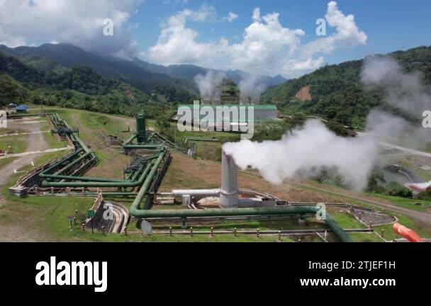 Thermal power plant on a volcano in the middle of the jungle, steam ...