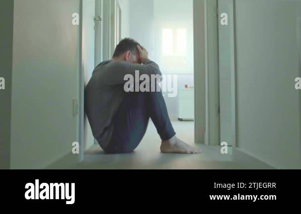 Female psychiatrist talking to male patient with mental disorder and ...