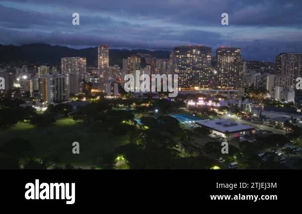 Downtown Waikiki beach after sunset. Scenic Honolulu skyline panorama ...