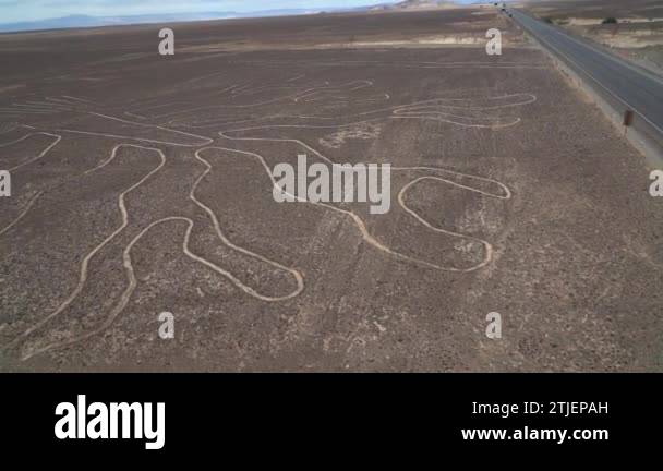 the famous nazca lines in the desert of Peru are a popular travel ...