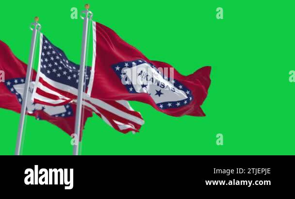 Arkansas and United States flags waving isolated on a green background ...