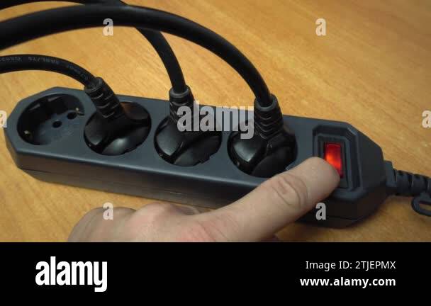 Insert plug into extension cord socket by pressing red push button ...