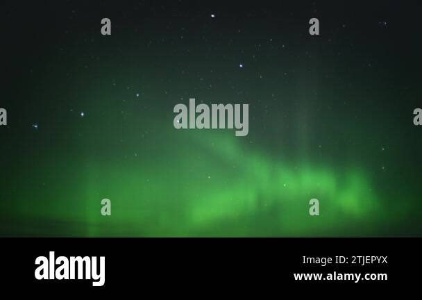 Northern Lights Aurora Borealis dancing on the night sky full of stars ...