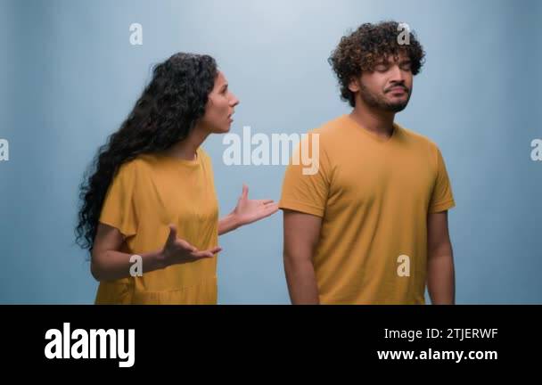 Multiracial couple diverse friends Indian man Hispanic woman quarrel ...