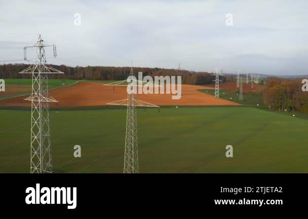 Power transmission towers against countryside landscape. Transmission ...