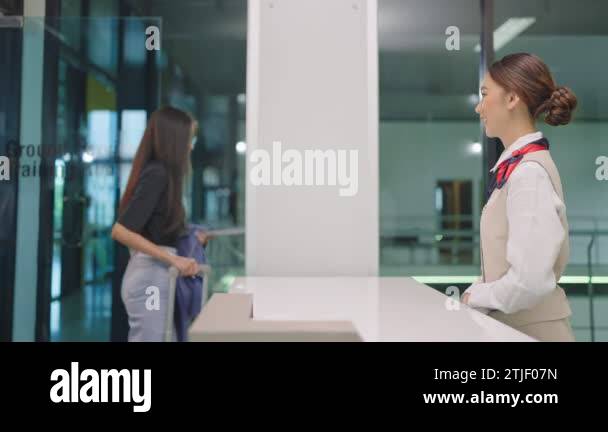 Asian passengers traveler giving boarding pass and passport to air ...