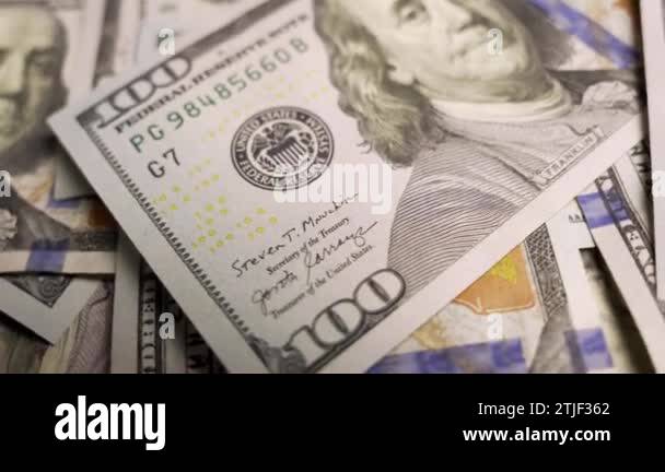 Heap of one hundred dollar bills spread out in a fan rotates. New 100 ...