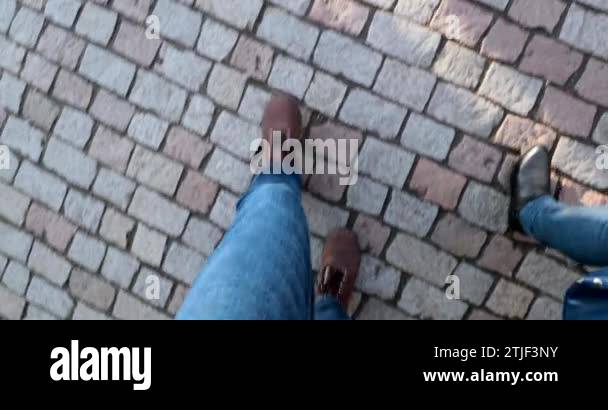 Point of view of man walking in cobblestone medieval town. POV of ...