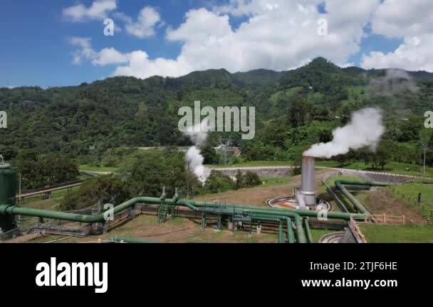 Thermal power plant on a volcano in the middle of the jungle, steam ...