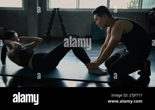 Fitness concept of 4k Resolution. Asian female athlete doing sit ups ...