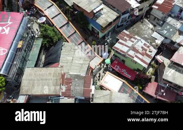 Medellin, Colombia, drone aerial view of Comuna 13 slums. Once one of ...