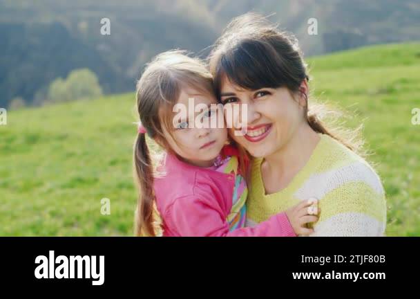 Young mother hugging her daughter three years Stock Video Footage - Alamy