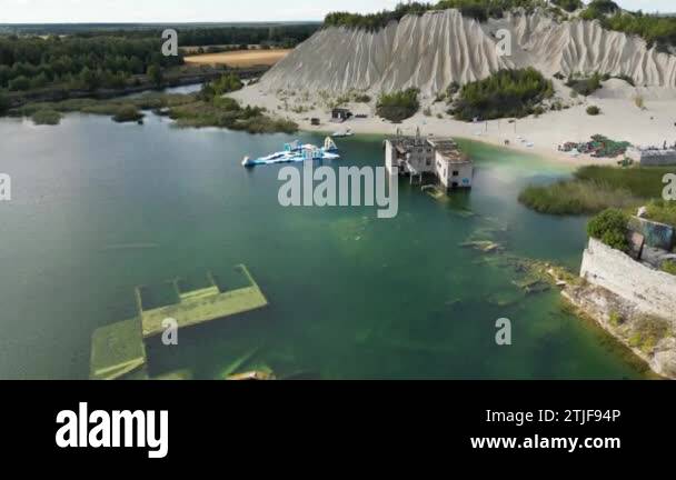 Abandoned Rummu quarry for extraction of limestone, turquoise lake with ...