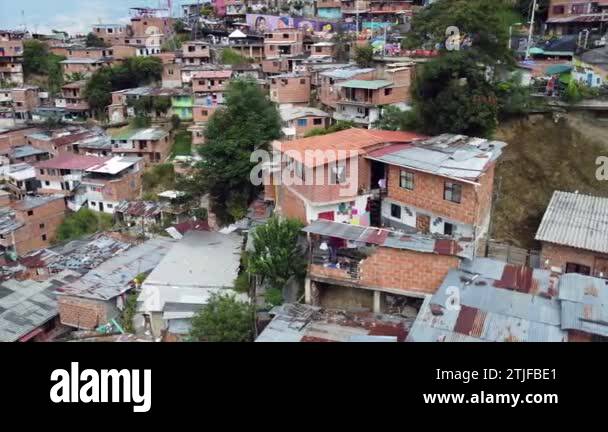 Medellin, Colombia, drone aerial view of Comuna 13 slums. Once one of ...