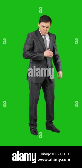 Full length of honest young male in elegant suit and tie putting hand ...