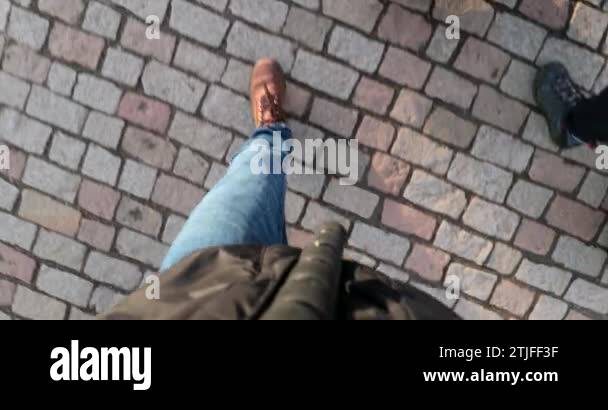 Point of view of man walking in cobblestone medieval town. POV of ...
