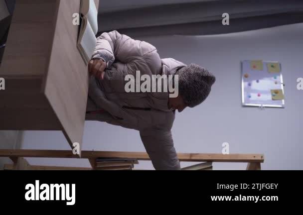 Student dressed in winter clothes feeling cold study at home with no ...