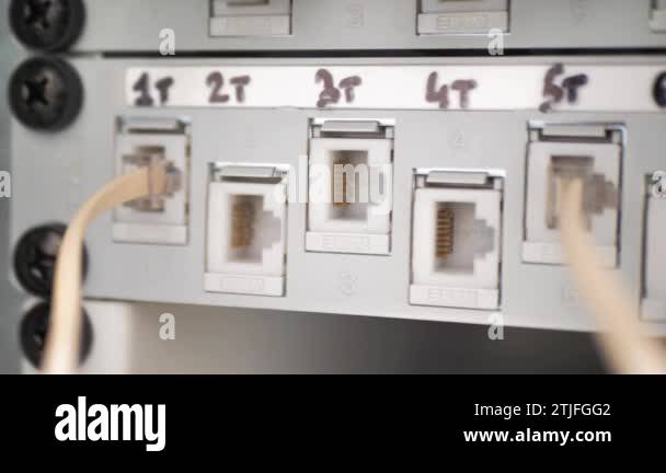 IT Engineer Patching Network Equipment In Server Room. Network Engineer ...