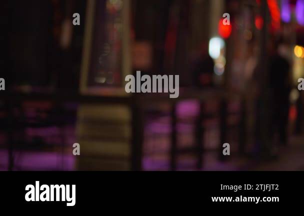 Background plate of out of focus downtown city street sidewalk at night ...