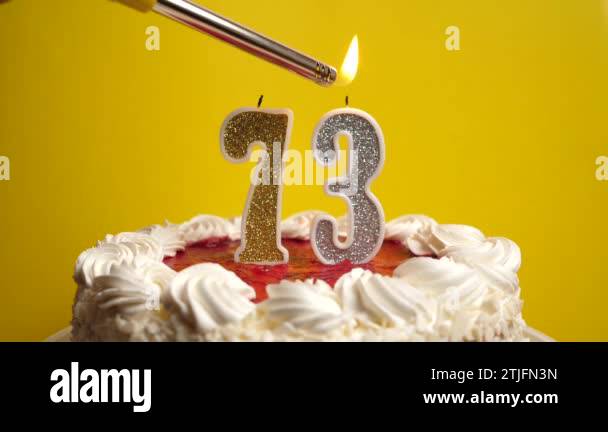 A candle in the form of the number 73, inserted into the holiday cake ...