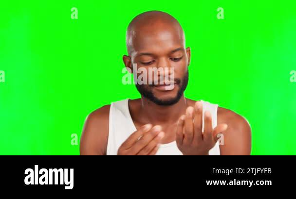 Beard, grooming and face of a black man on a green screen isolated on a ...