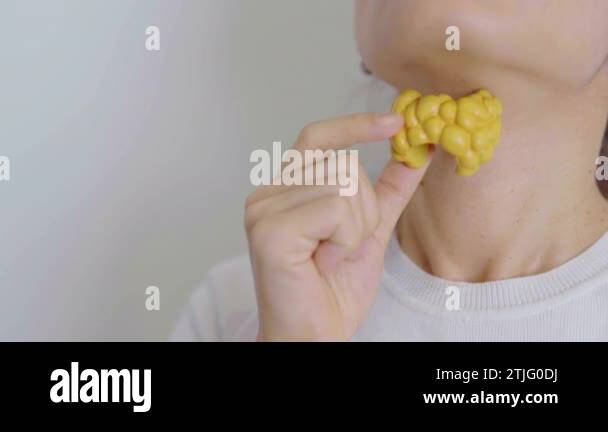 Woman Holding Human Thyroid Anatomy Model With Her Neck 5110