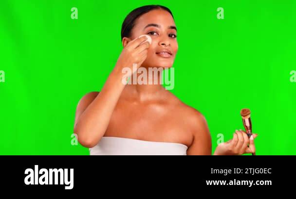Green screen, makeup and woman face with brush and blender in studio ...