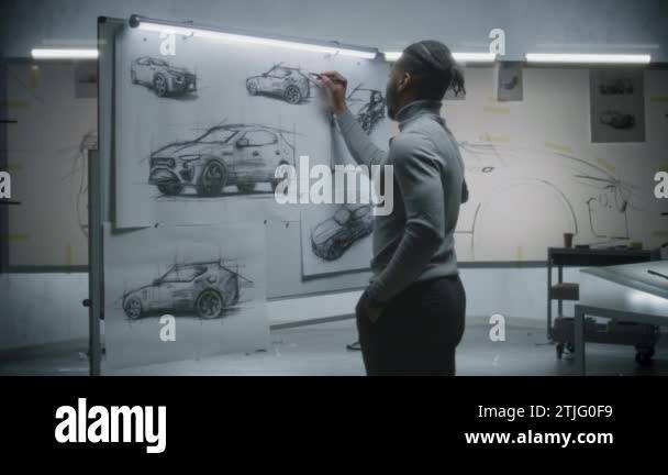 Two diverse automotive male designers drawing sketches with marker on ...