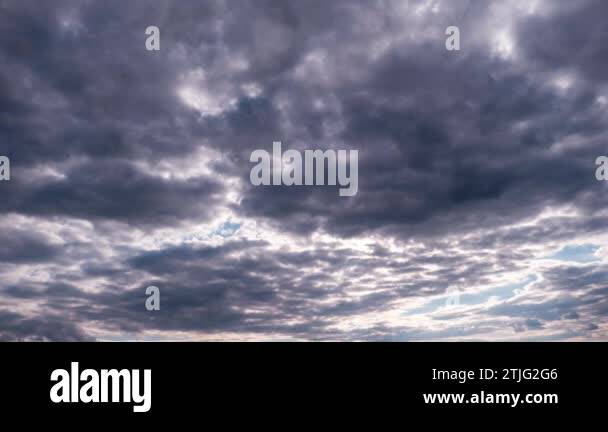 Clouds moving under the sun in the blue sky, time-lapse. Cloud space ...