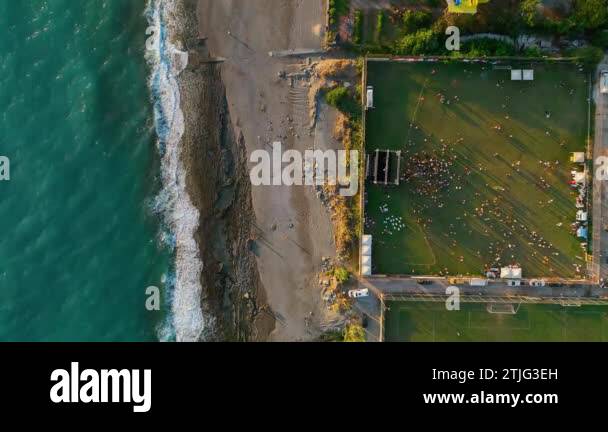 Young people holding hands up, relaxing at outdoor party, having fun ...