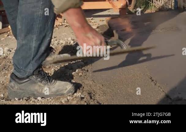 Builder hand leveling concrete Stock Videos & Footage - HD and 4K Video ...