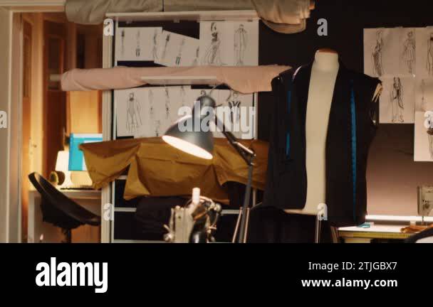 Industrial mannequin and drawings in sewing shop, tools used to create ...