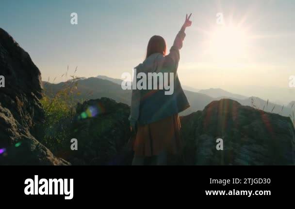 Back view of strong woman standing and fighting motivation feeling on ...