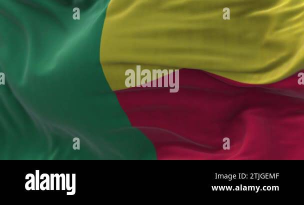 Close-up view of the Benin national flag waving in the wind. The Republic of Benin is a country ...
