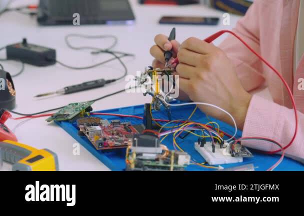Man Worker with Multimeter Measuring Instrument in Office. Electronics ...