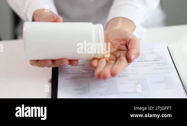 Female doctor pours omega-3 fish oil capsule on hand. Omega 3 ...