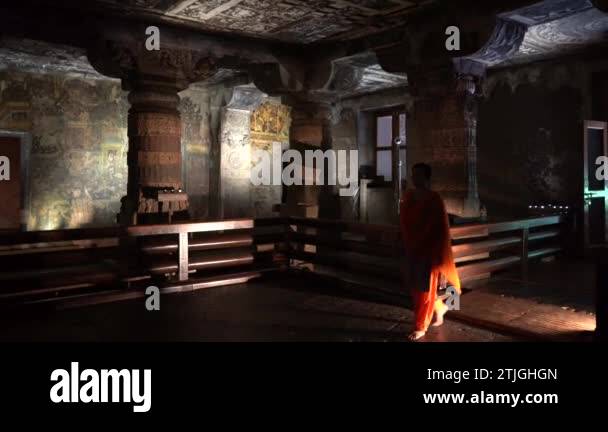Woman tourist visit to the Ajanta caves and exploring the ancient ...