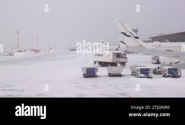 Helsinki, Finland - Circa 2022: Airplanes in blizzard, airport ...