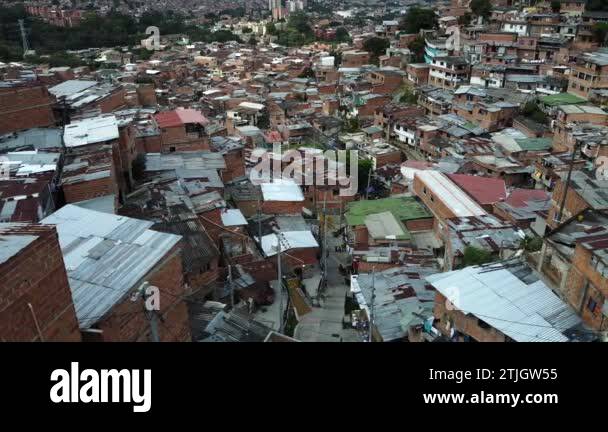 Medellin, Colombia, drone aerial view of Comuna 13 slums. Once one of ...