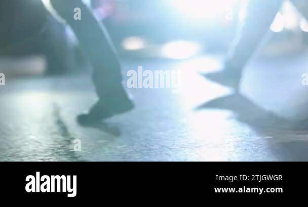 Crowded Low-angle perspective of pedestrians crossing street with lens ...
