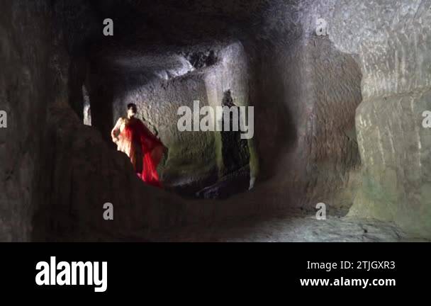 Woman tourist visit to the Ajanta caves and exploring the ancient ...