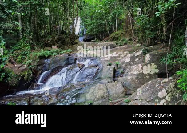 Drone footage of a waterfall in the philippines. In this footage we are ...