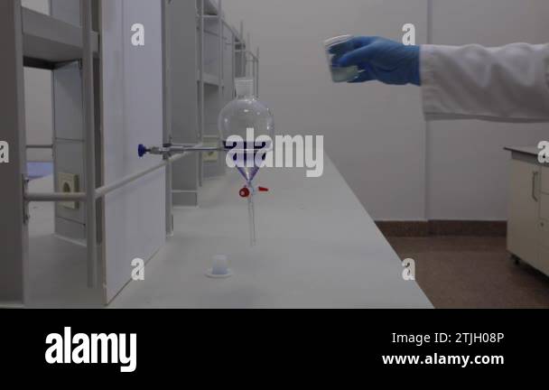 Separating funnel laboratory glassware used in liquid-liquid ...