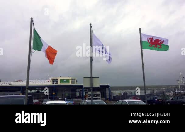Pembroke Ferry Port, Wales - Feb 06 2022: Irish, Irish Ferries and Welch flags blowing in the ...